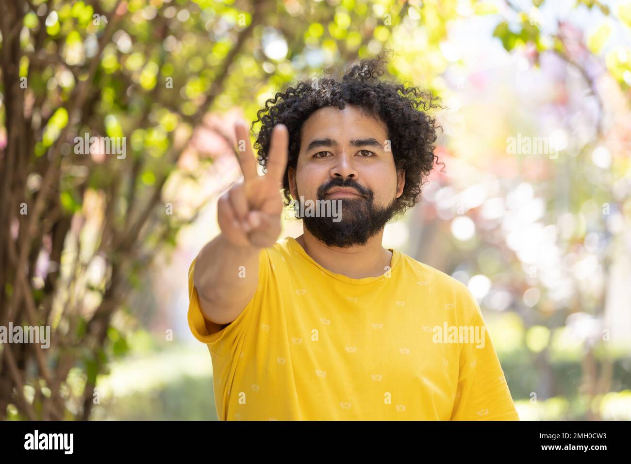 Man making peace sign hi-res stock photography and images - Alamy