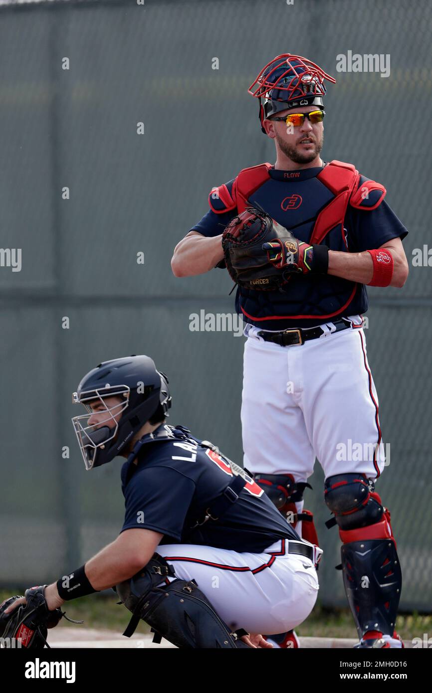 Atlanta Braves catcher Tyler Flowers (25) looks on as Shea Langeliers ...