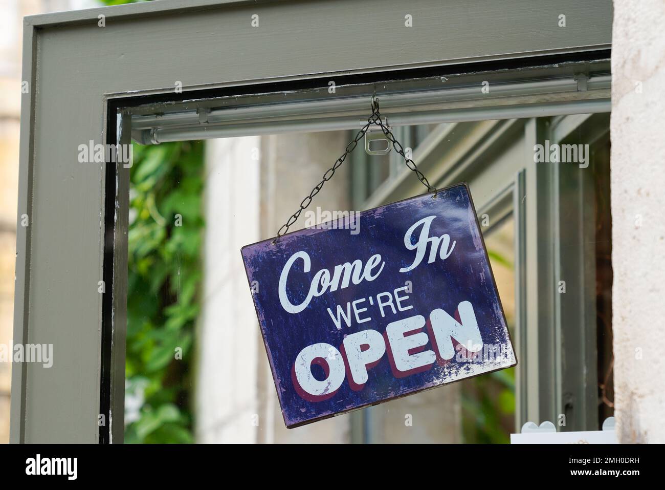 open sign board blue hang on street shop restaurant cafe store door ...
