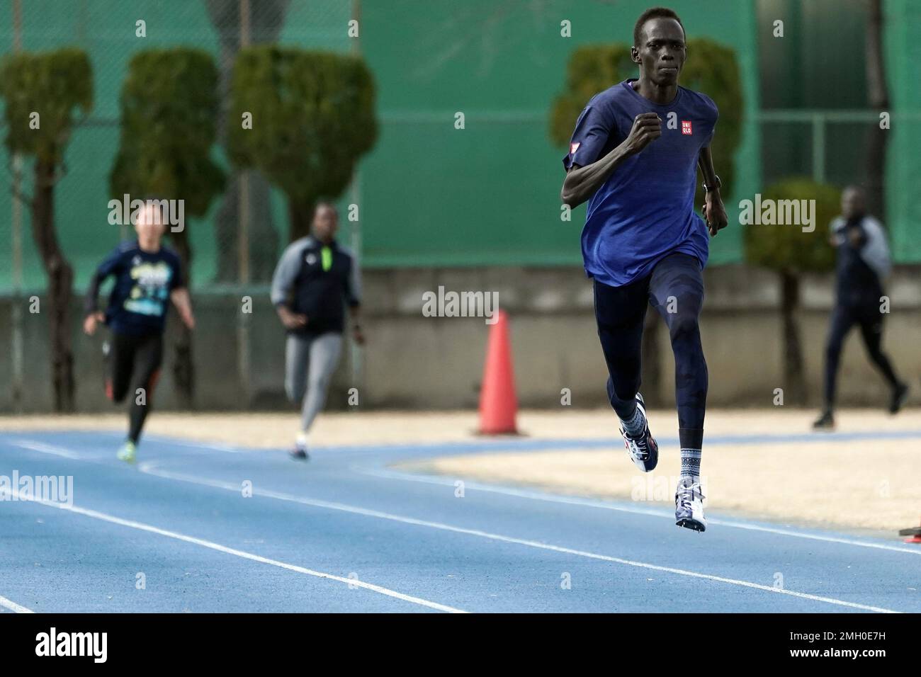 In this Feb. 12, 2020 photo, Joseph Akoon Akoon, right, and other of ...