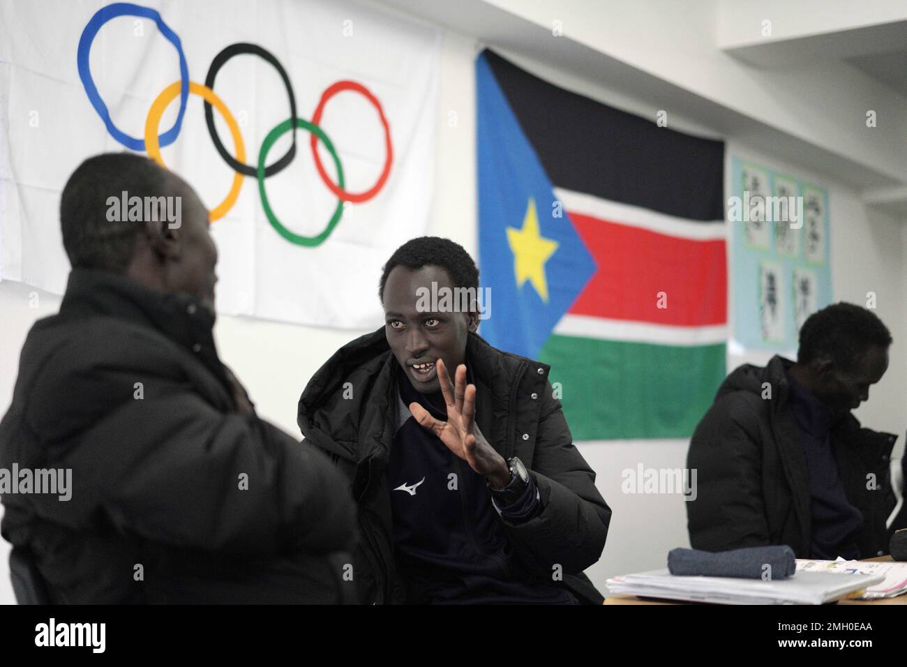 In this Feb. 12, 2020, photo, Abraham Majok, center and other ...