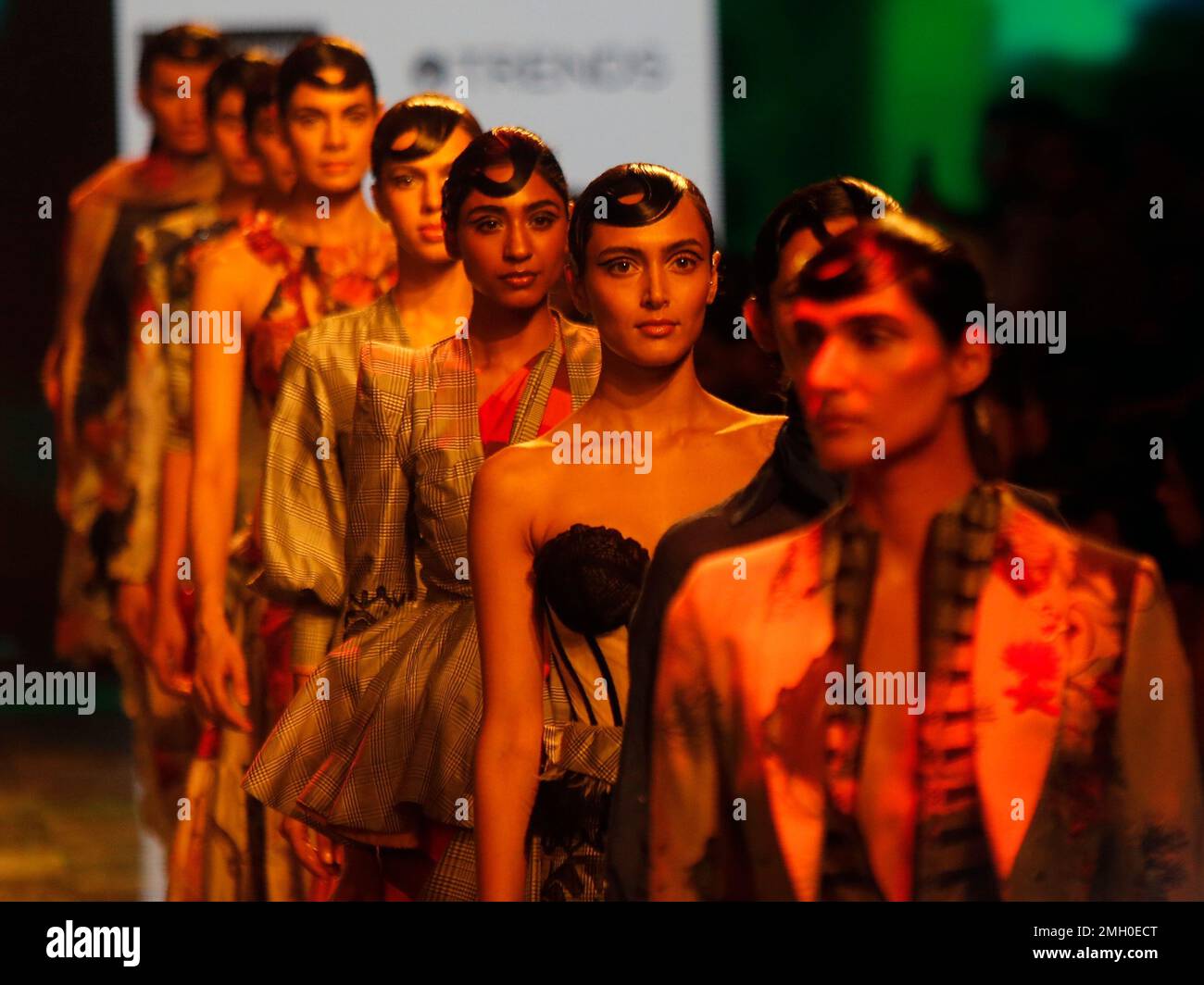 Models walk the ramp to showcase the creations of House of Three X ...