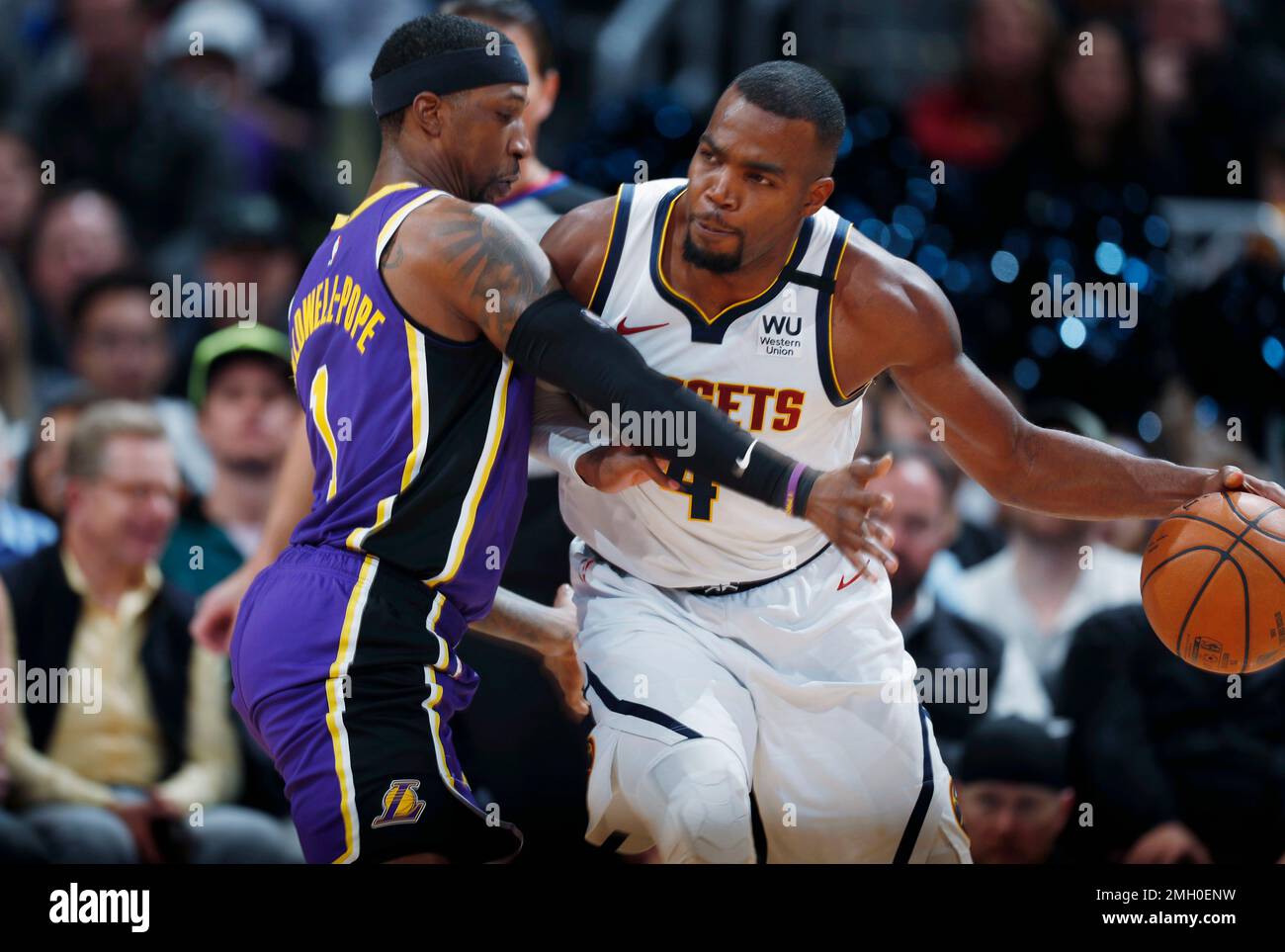 Los Angeles Lakers guard Kentavious Caldwell-Pope, left, blocks Denver ...