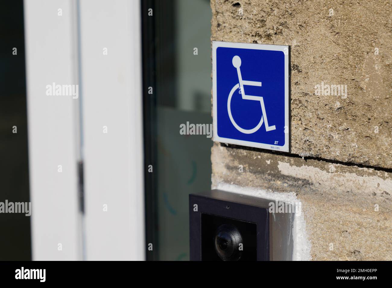 Handicapped sign logo on wall entrance store access pictogram on street ...