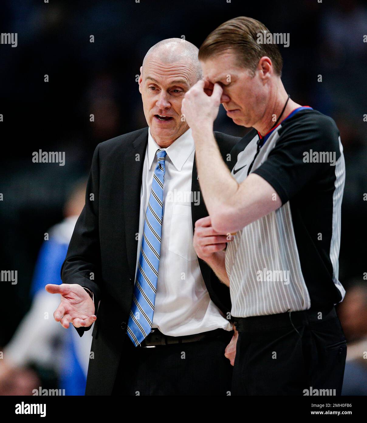 Dallas Mavericks coach Rick Carlisle argues a call with referee Ed ...