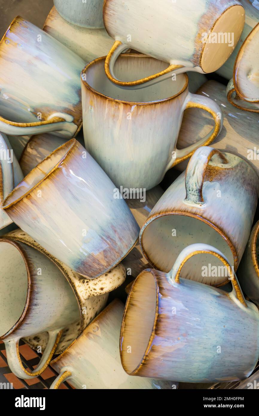 Handmade ceramic mugs stacks background Stock Photo - Alamy