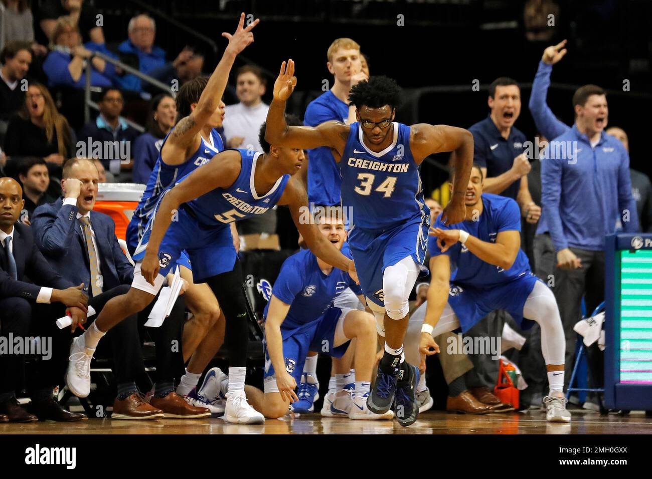 Creighton guard Denzel Mahoney (34) reacts in front of his bench after ...