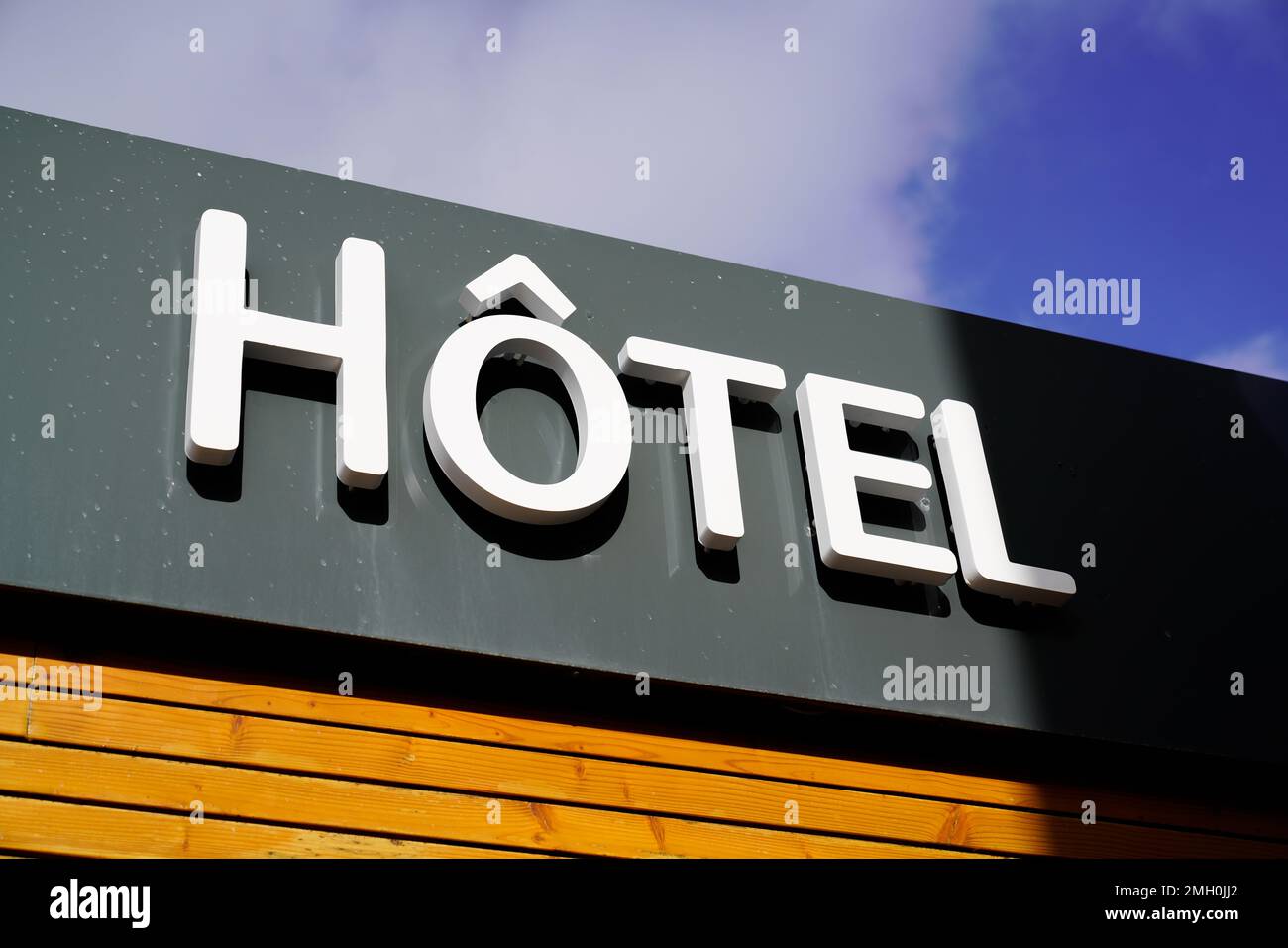 Hotel sign text in wooden vintage retro style on Building in tourist ...