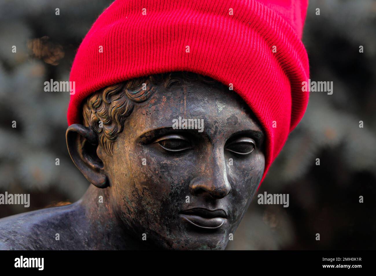 A 19th century statue depicting the Roman god Mercury, decorated with a ...