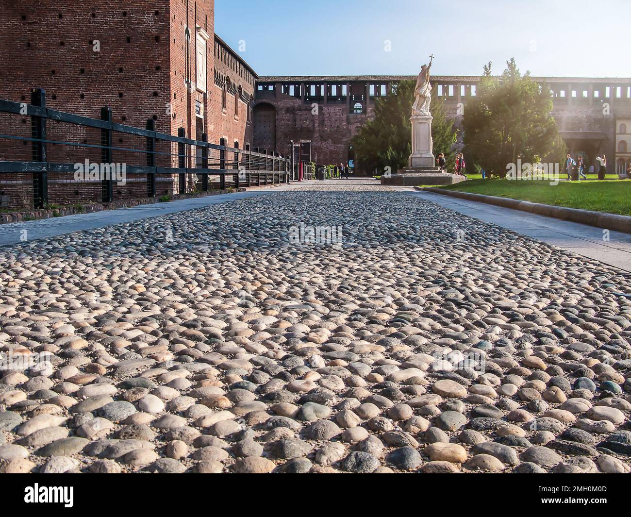 Courtyard and cobblestone pavement of Castello Sforza, Milan, Lombardy ...