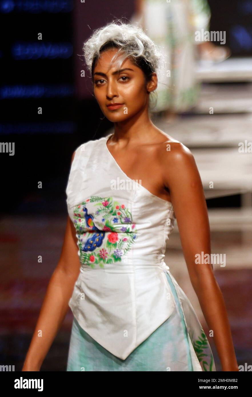 A model walks the ramp to showcase the creation of designer Sadia Rupa ...
