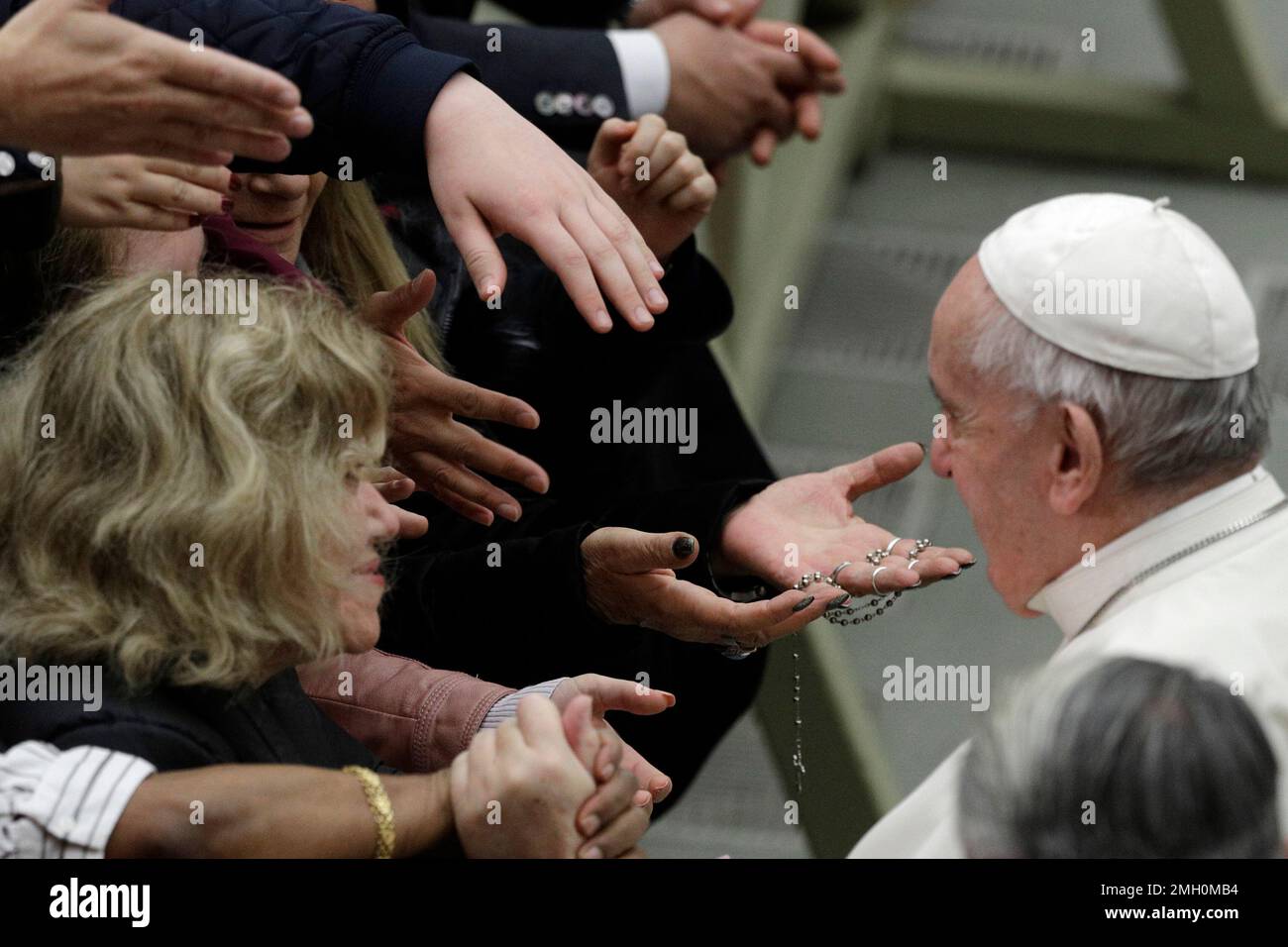 Pope Francis is greeted by faithful during the weekly general audience ...