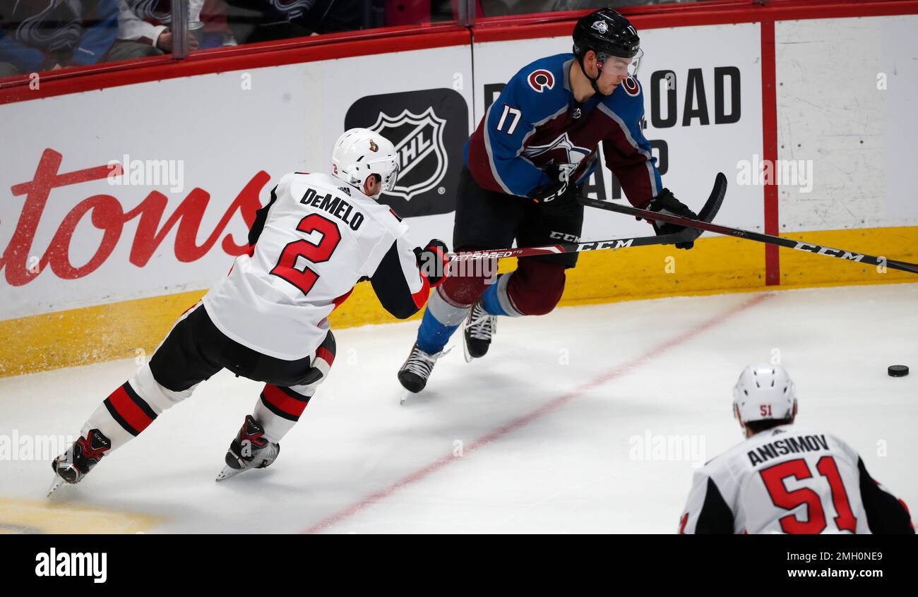 Colorado Avalanche center Tyson Jost, right, reaches out for a loose ...