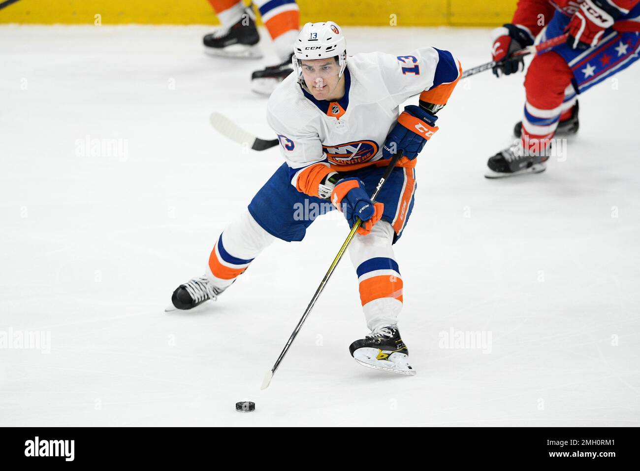 New York Islanders center Mathew Barzal (13) skates with the puck ...
