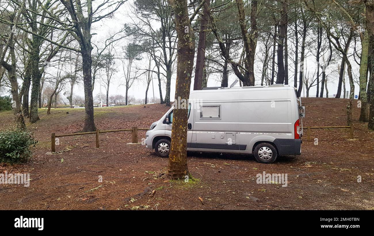motorhome at Biscarrosse lake under the pine trees of the forest in ...