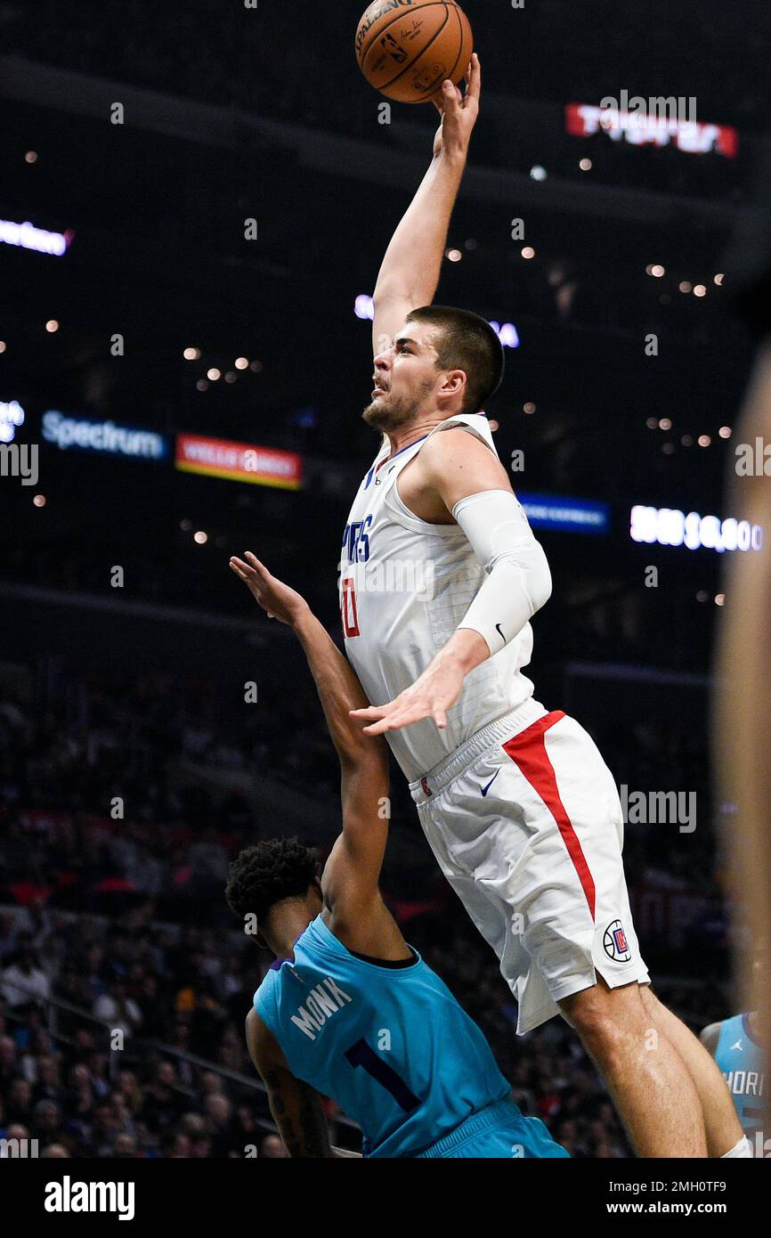 Los Angeles Clippers center Ivica Zubac, right, goes up for a dunk on ...
