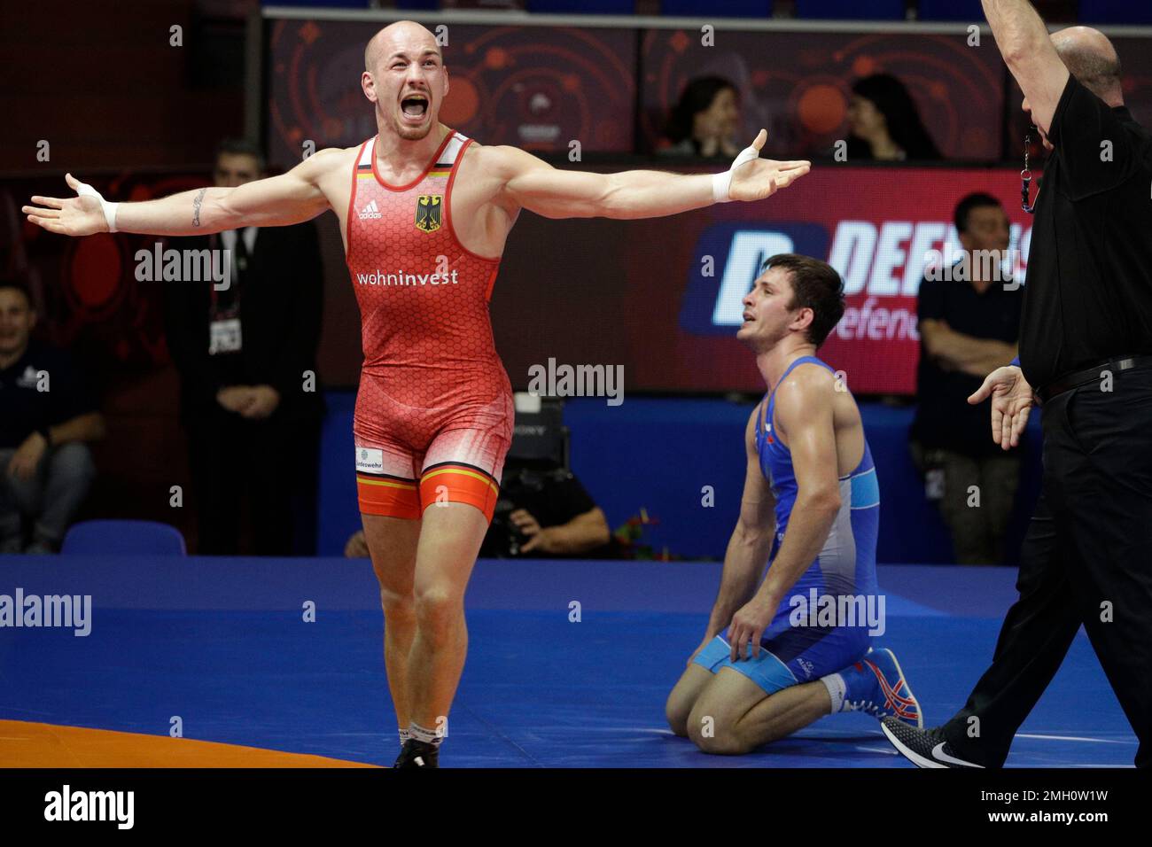 Germany's Frank Staebler, left, celebrates after winning against Russia ...