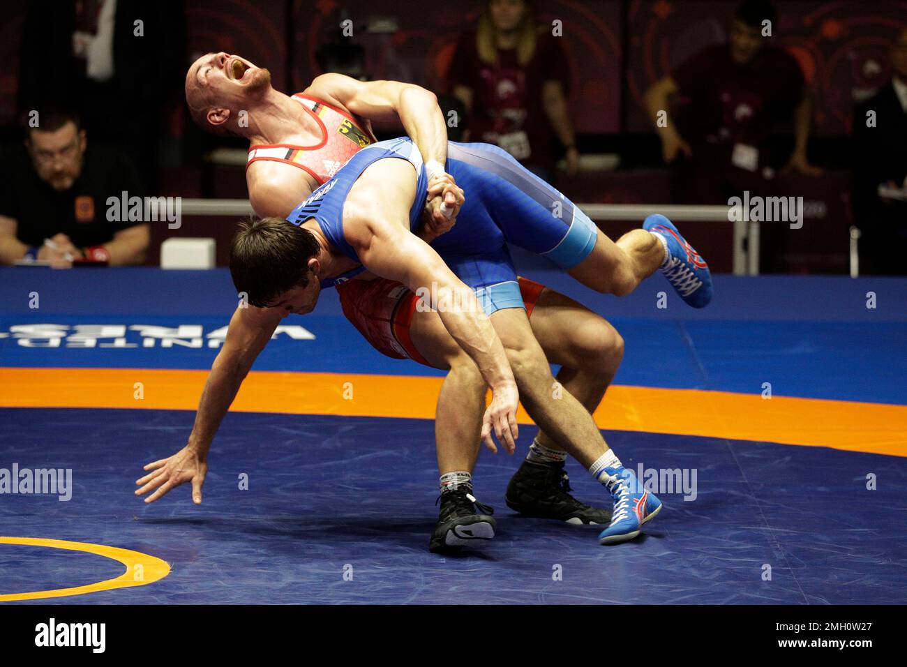 Germany's Frank Staebler, top, and Russia's Adam Kurak fight during the ...