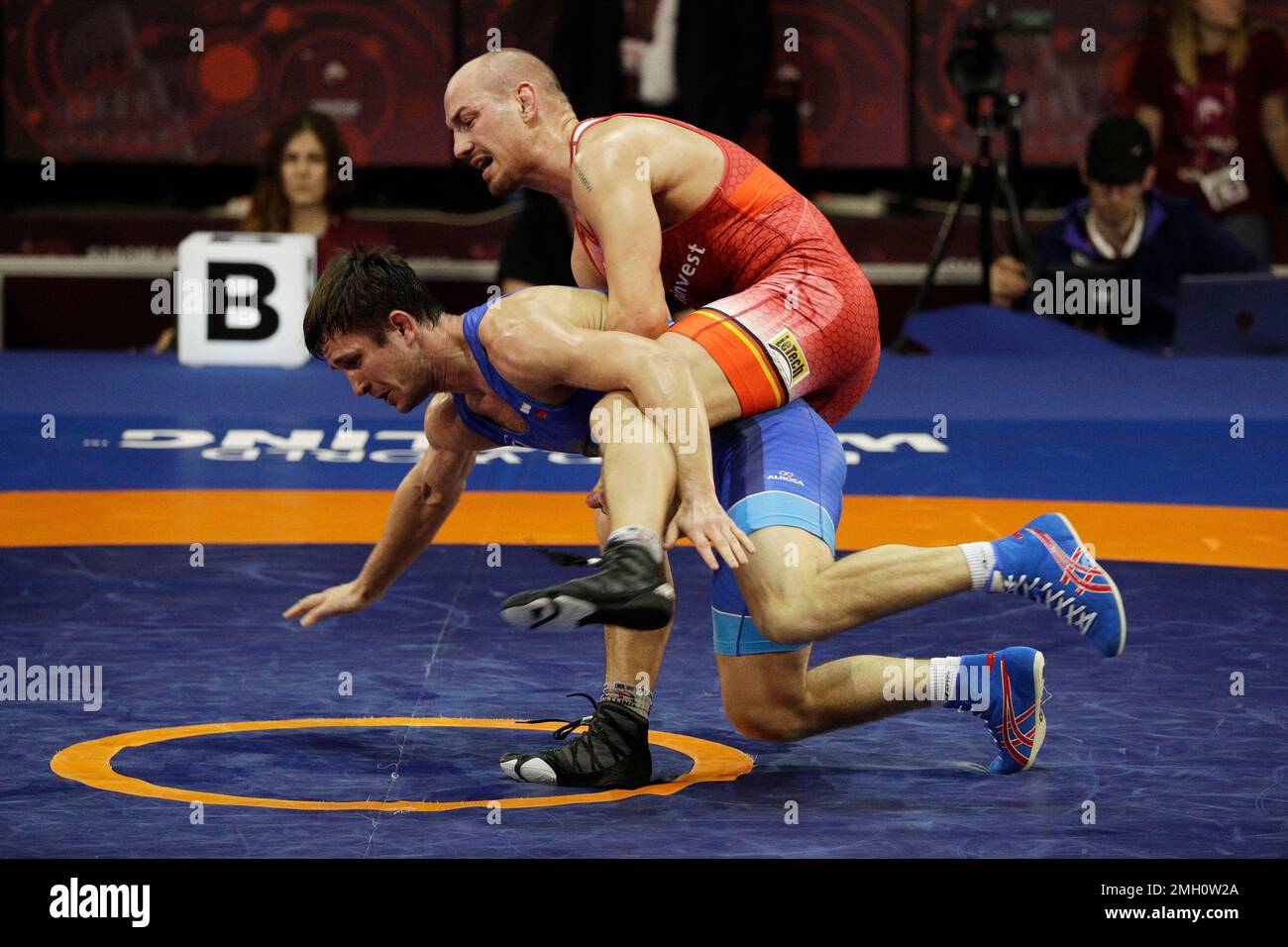 Germany's Frank Staebler, top, and Russia's Adam Kurak fight during the ...