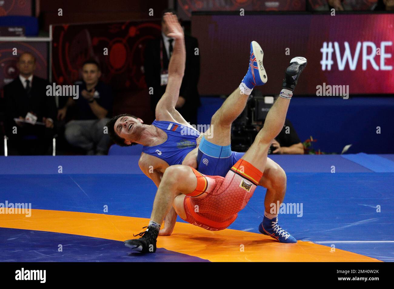 Germany's Frank Staebler, bottom, and Russia's Adam Kurak fight during ...