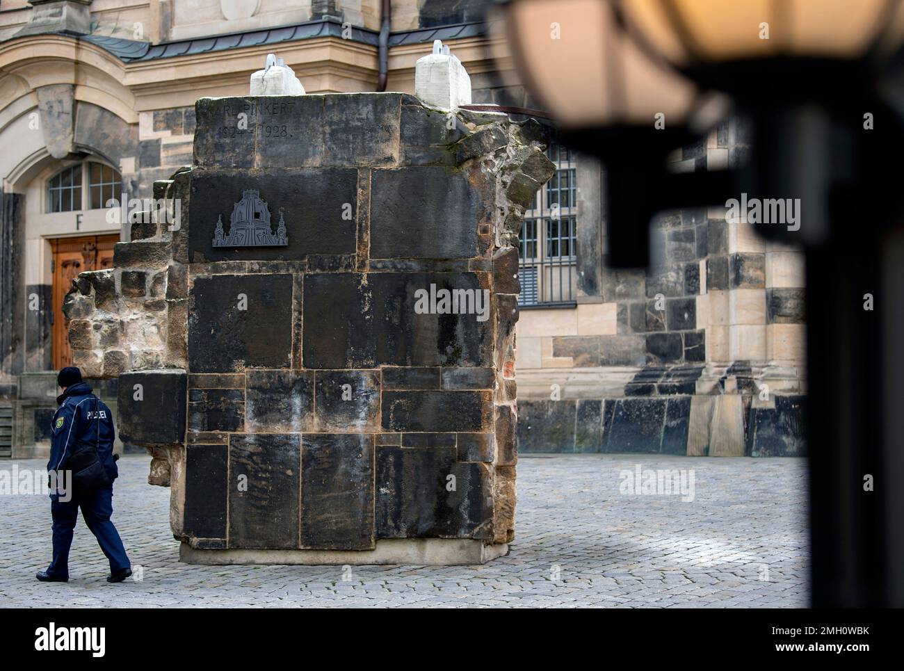 A memorial stone stands in front of the Frauenkirche cathedral (Church ...