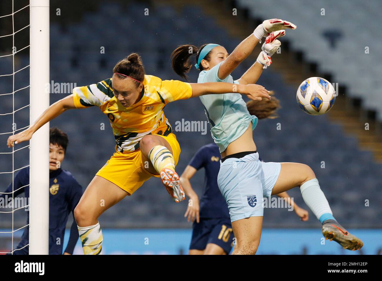 Caitlin Foord of Australia challenges the ball against Thailand's ...