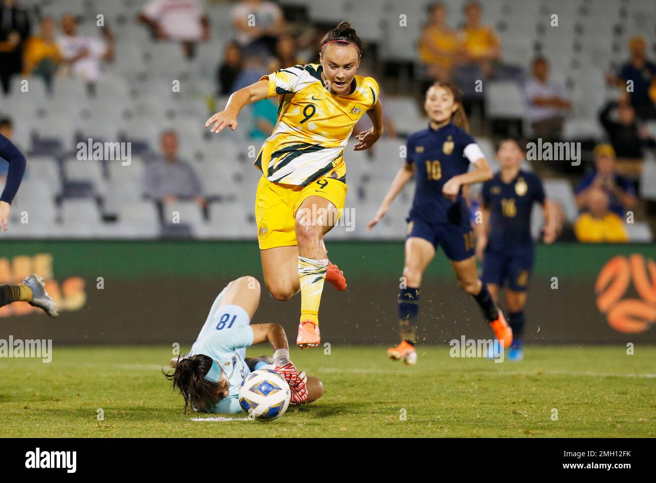 Caitlin Foord of Australia challenges the ball against Thailand's ...
