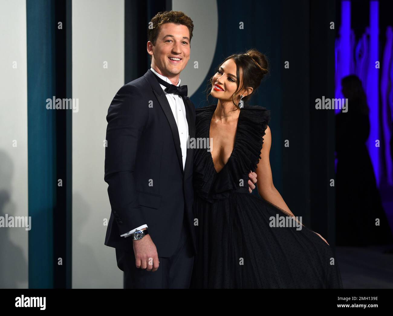 Miles Teller, left, and Keleigh Sperry arrive at the Vanity Fair Oscar ...