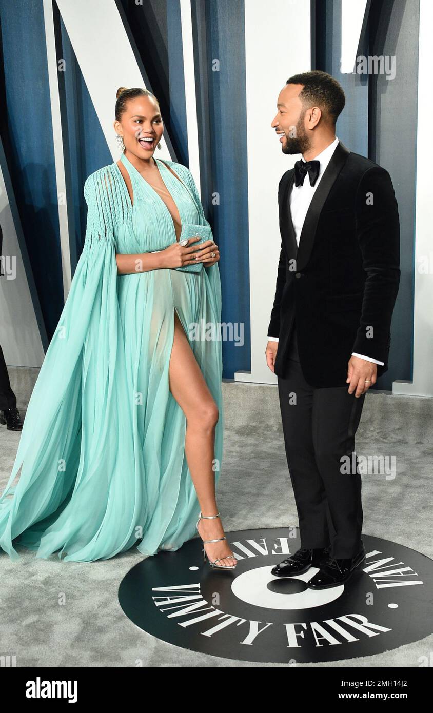 Chrissy Teigen, left, and John Legend arrive at the Vanity Fair Oscar ...