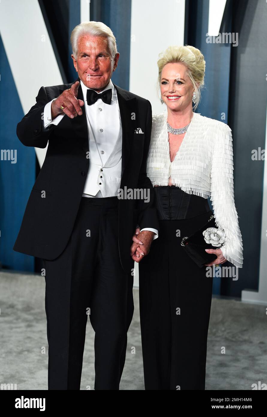 George Hamilton, left, and Barbara Sturm arrive at the Vanity Fair ...