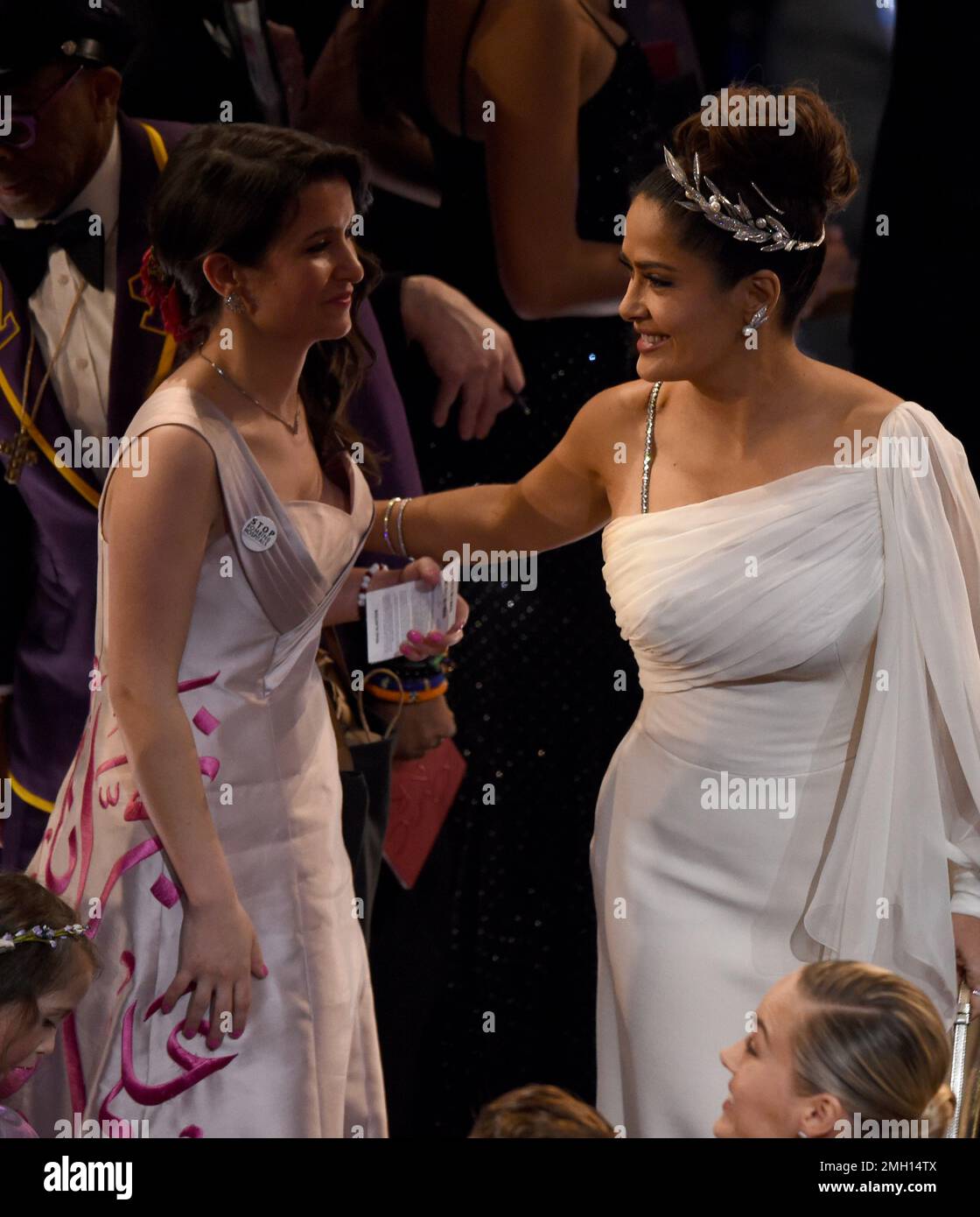 Waad Al-Kateab, left, and Salma Hayek appear in the audience at the ...