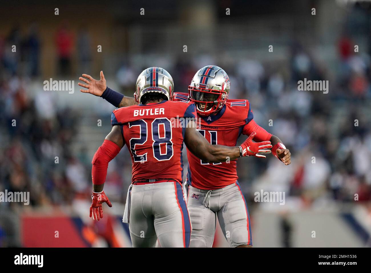 Houston Roughnecks quarterback P.J. Walker (11) celebrates with James ...