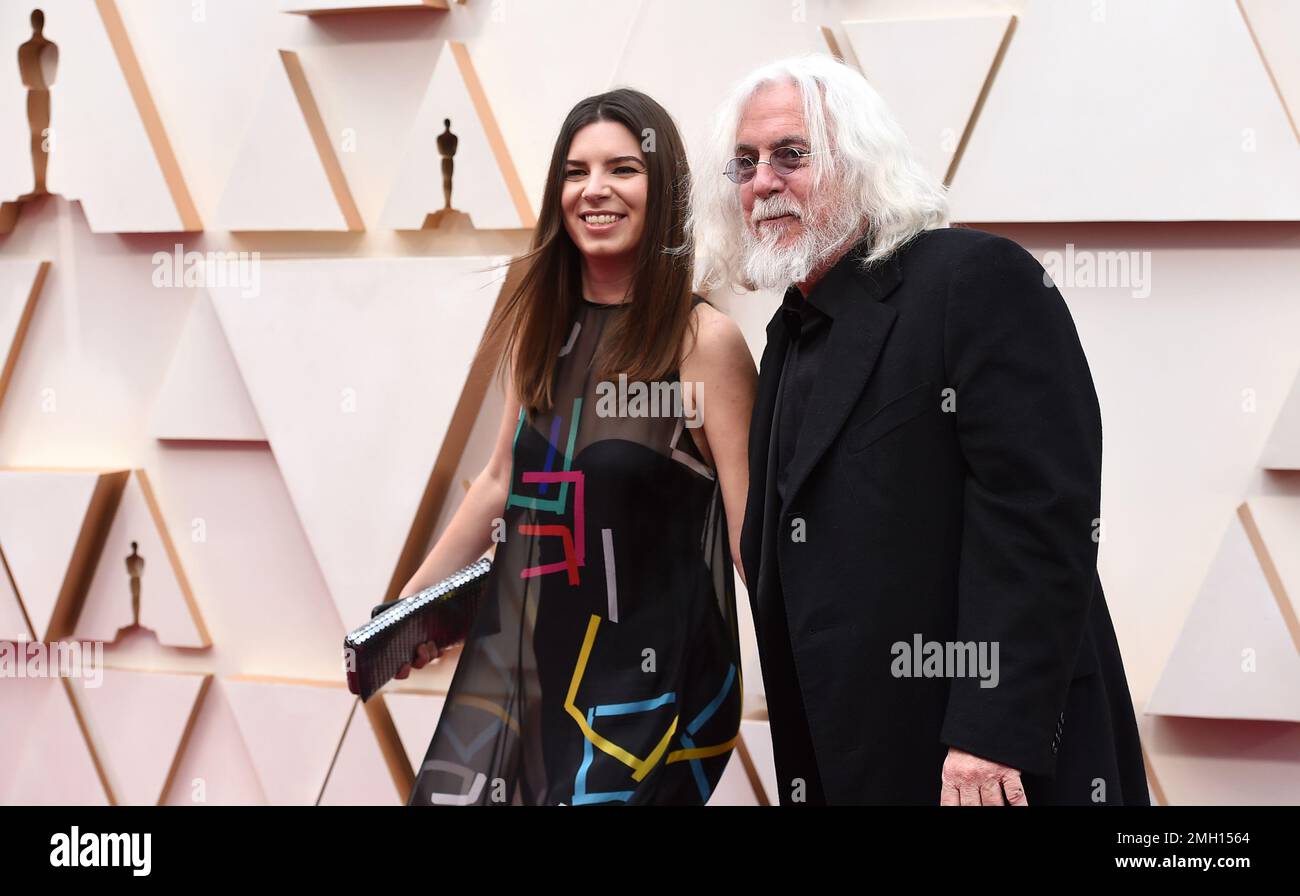 Robert Richardson, right, arrives at the Oscars on Sunday, Feb. 9, 2020 ...