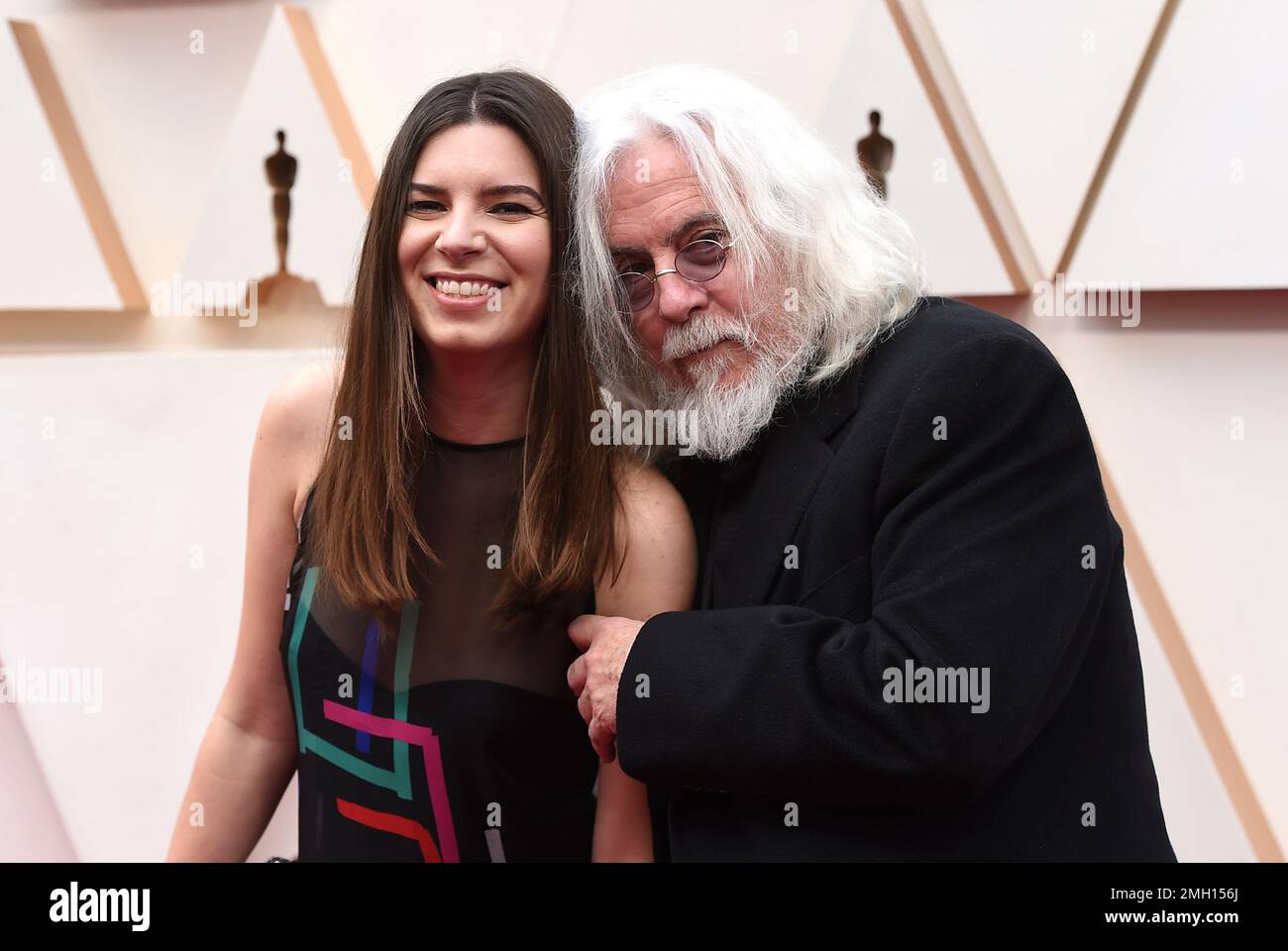 Robert Richardson, right, arrives at the Oscars on Sunday, Feb. 9, 2020 ...