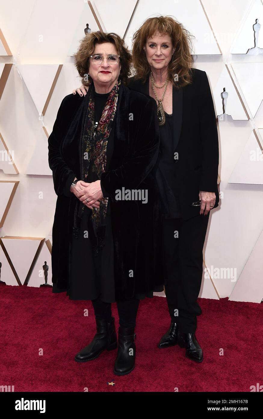 Barbara Ling, left, arrives at the Oscars on Sunday, Feb. 9, 2020, at ...