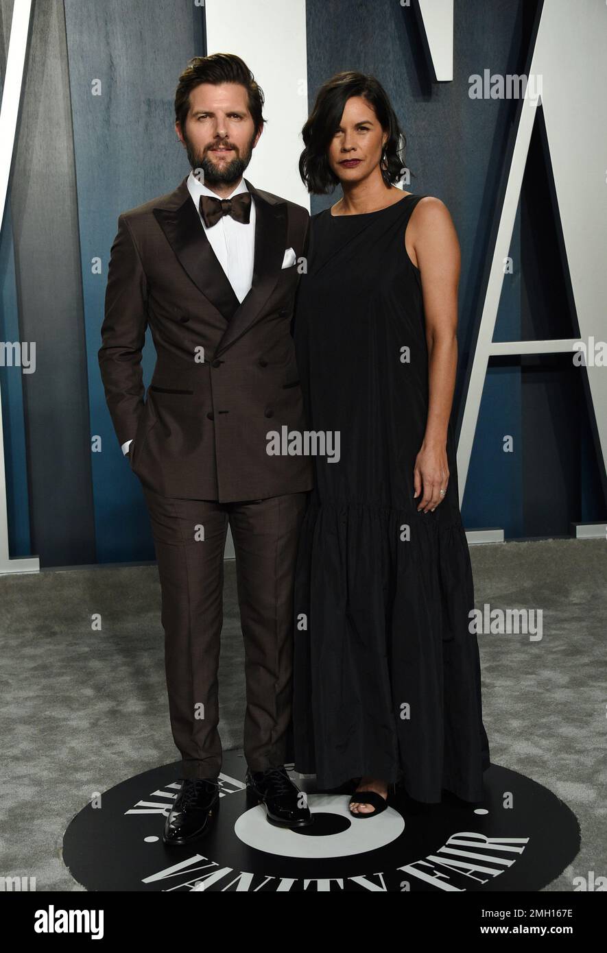 Adam Scott, left, and Naomi Scott arrive at the Vanity Fair Oscar Party on Sunday, Feb. 9, 2020 ...