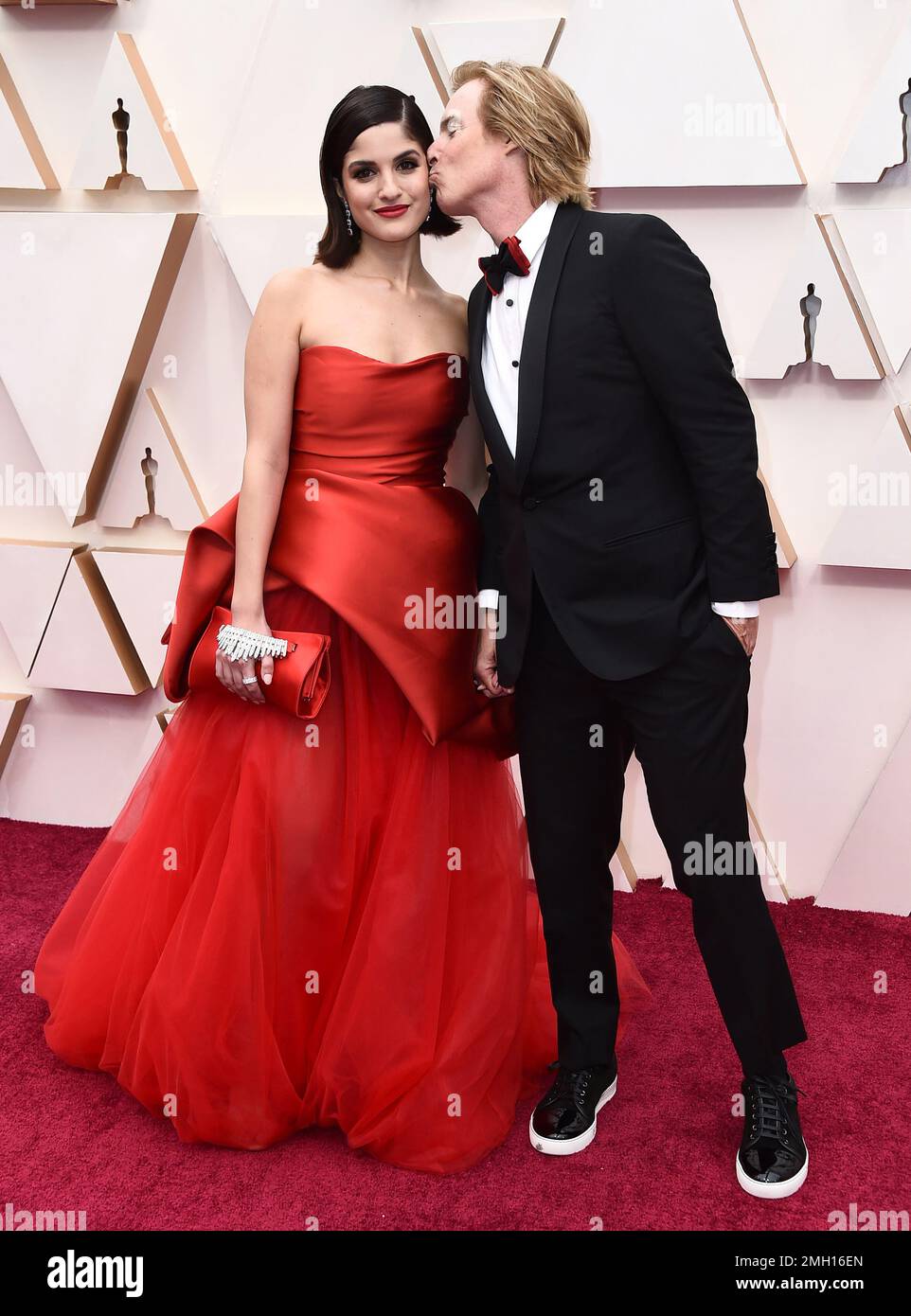 Kiana Madani and director Bryan Buckley arrive at the Oscars on Sunday ...