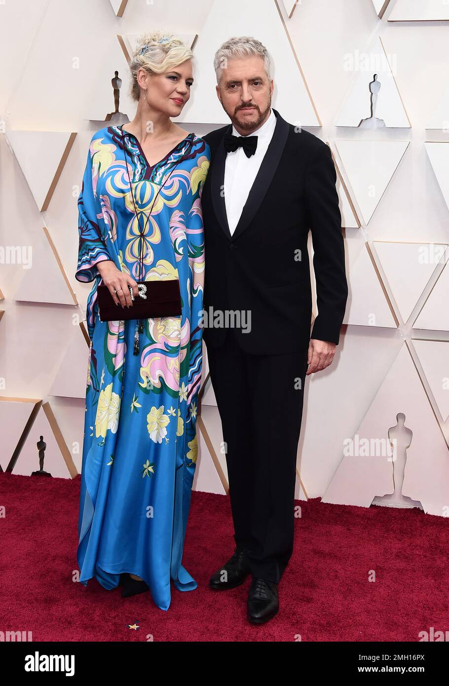 Anthony McCarten, right, and Eva Maywald arrive at the Oscars on Sunday ...