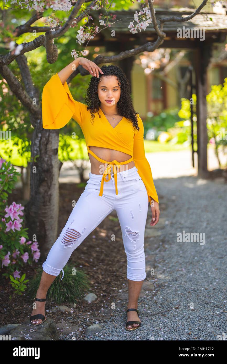 Beautiful Young African American Woman Playing Around Under Blossoming ...