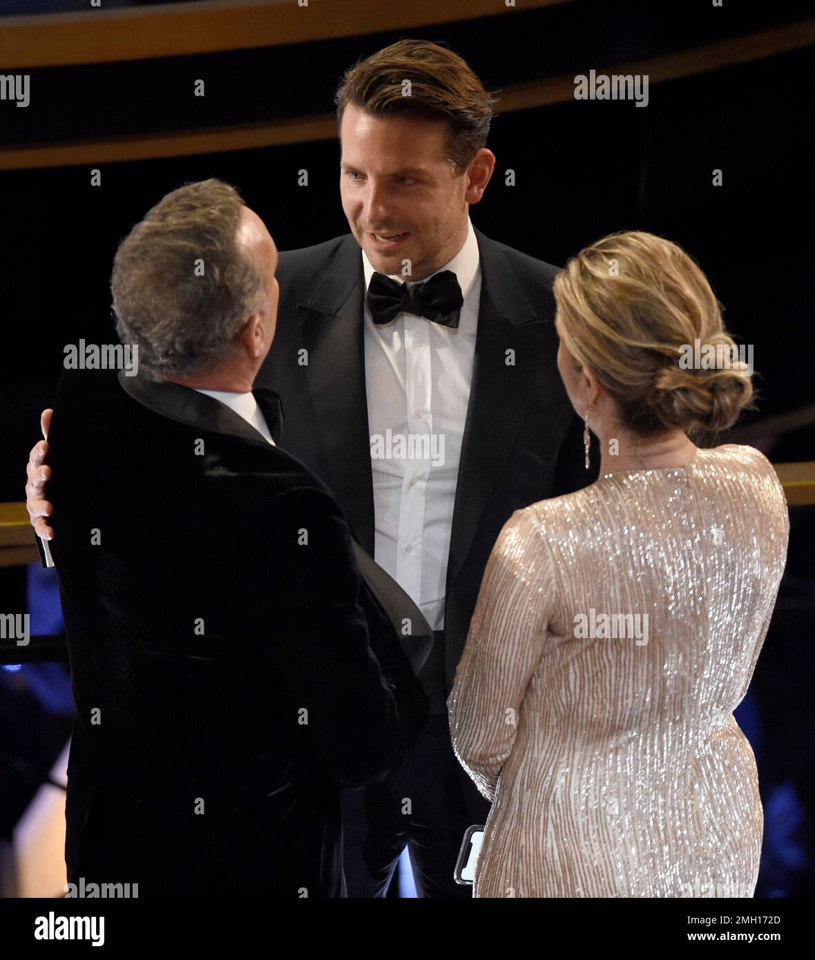 Tom Hanks, from left, Bradley Cooper and Rita Wilson speak in the ...