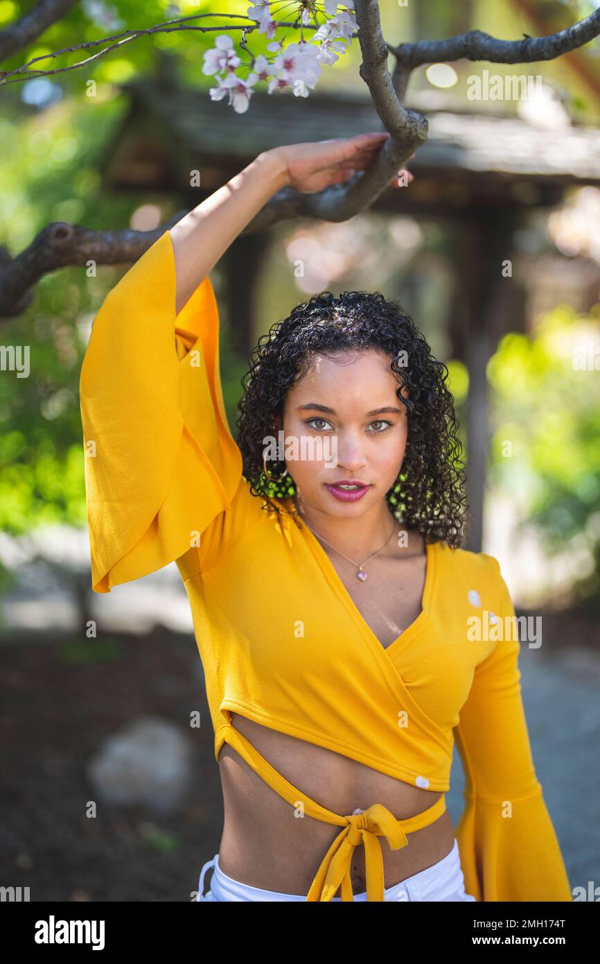 Beautiful Young African American Woman Playing Around Under Blossoming ...