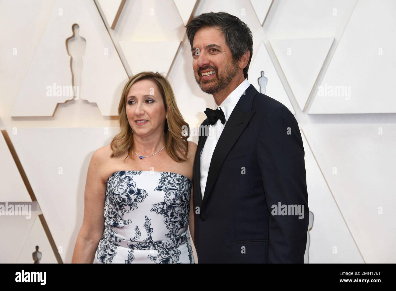Anna Romano, left, and Ray Romano arrive at the Oscars on Sunday, Feb ...