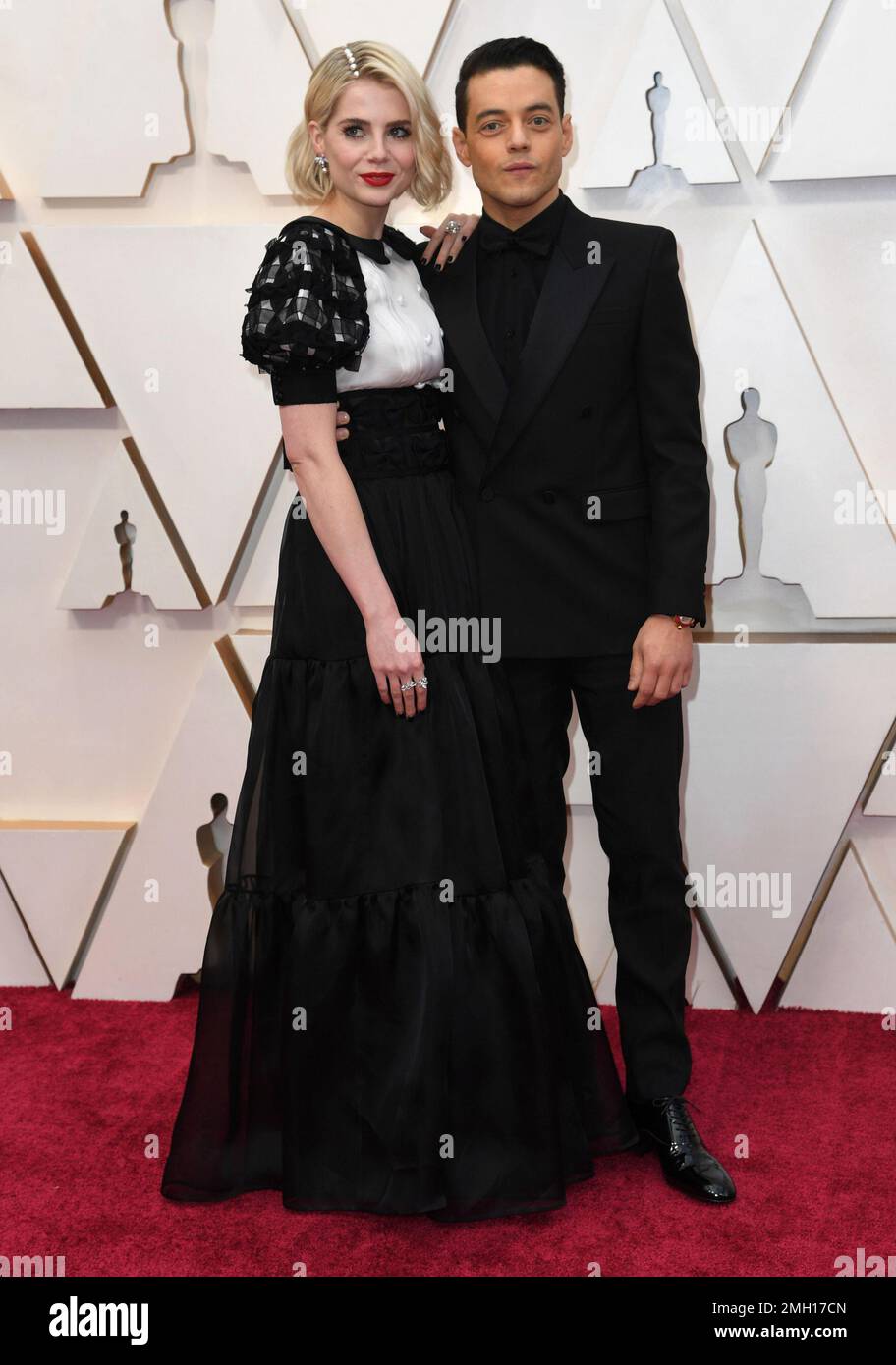 Lucy Boynton, left, and Rami Malek arrive at the Oscars on Sunday, Feb ...
