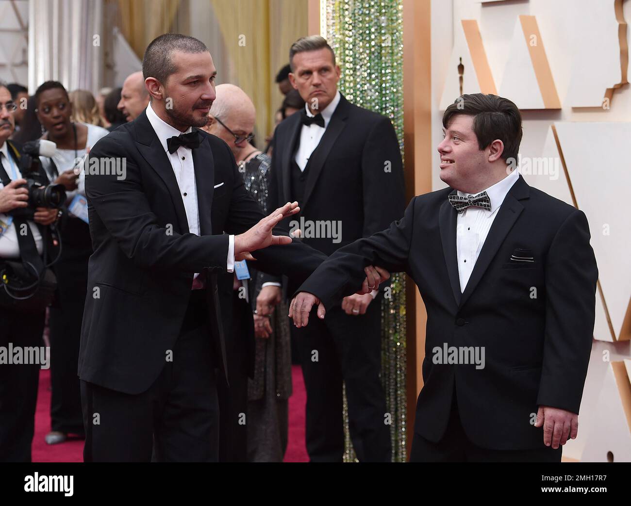 Shia LaBeouf, left, and Zack Gottsagen arrive at the Oscars on Sunday ...