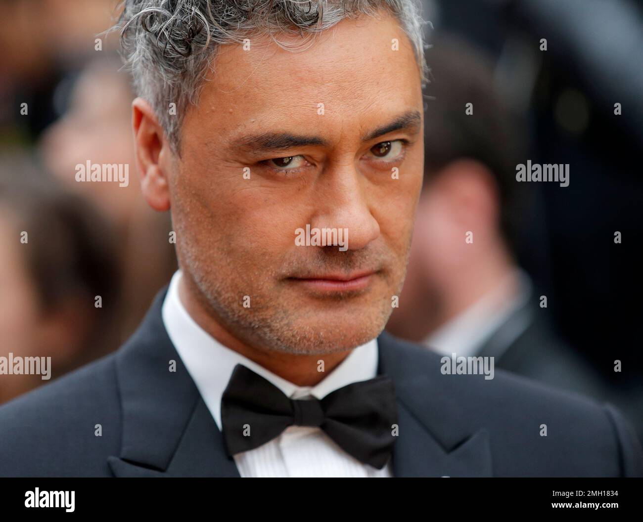 Taika Waititi arrives at the Oscars on Sunday, Feb. 9, 2020, at the ...