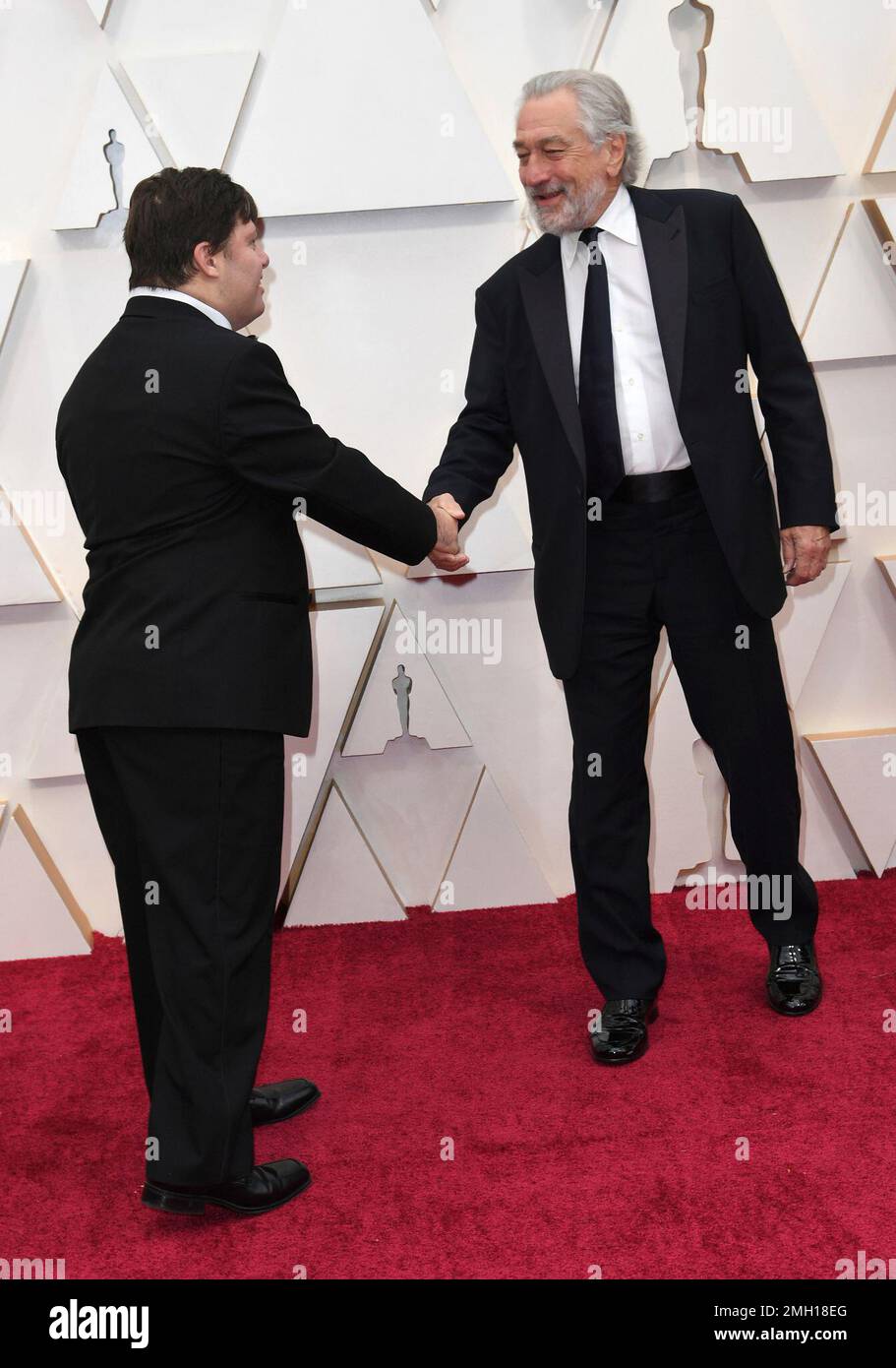 Zack Gottsagen, left, and Robert De Niro arrive at the Oscars on Sunday ...