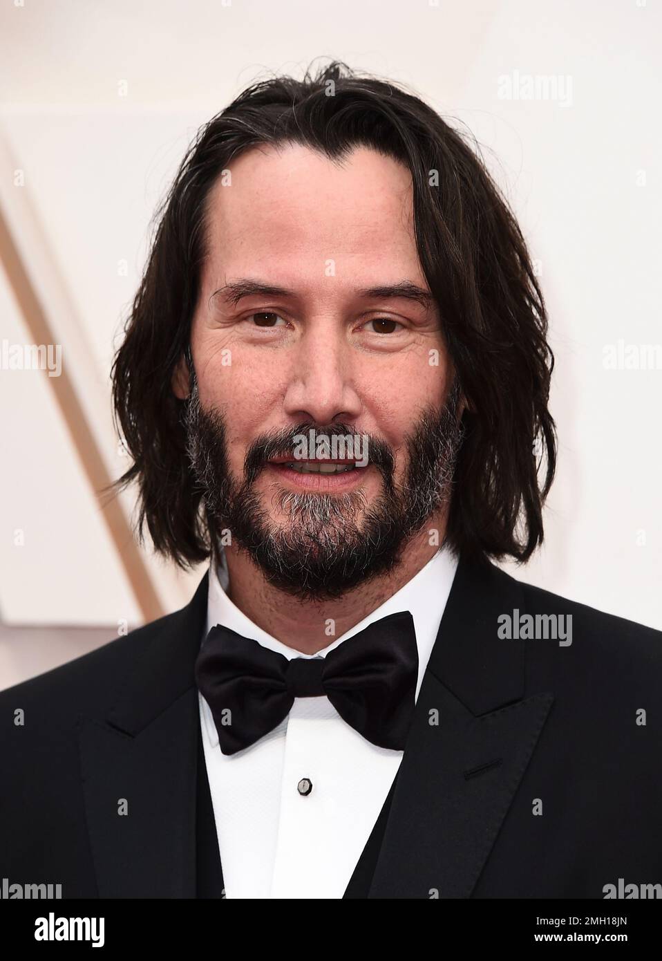 Keanu Reeves arrives at the Oscars on Sunday, Feb. 9, 2020, at the ...