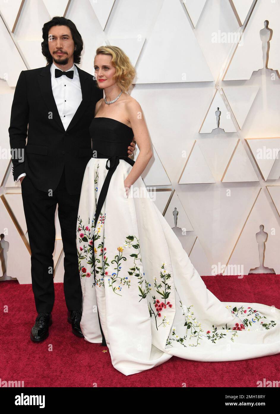Adam Driver, left, and Joanne Tucker arrive at the Oscars on Sunday ...