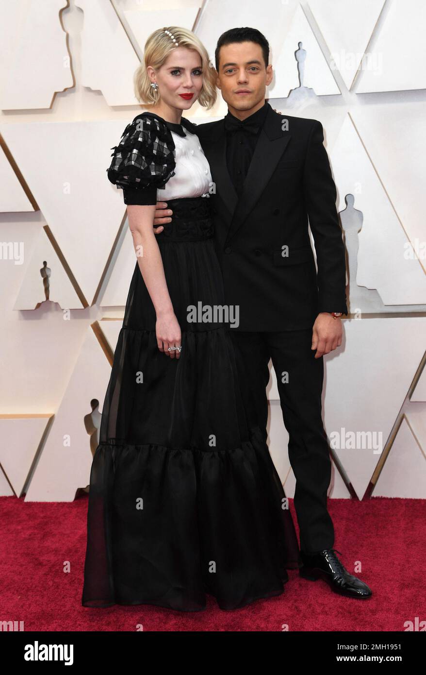 Lucy Boynton, left, and Rami Malek arrive at the Oscars on Sunday, Feb ...
