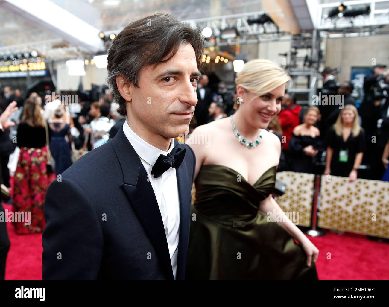 Noah Baumbach, left, and Greta Gerwig arrive at the Oscars on Sunday ...